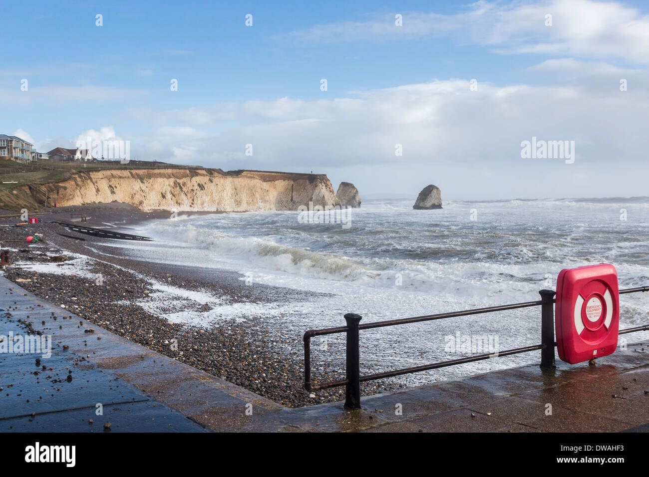 Freshwater Bay and chalk headland with breaking waves on a windy day ...