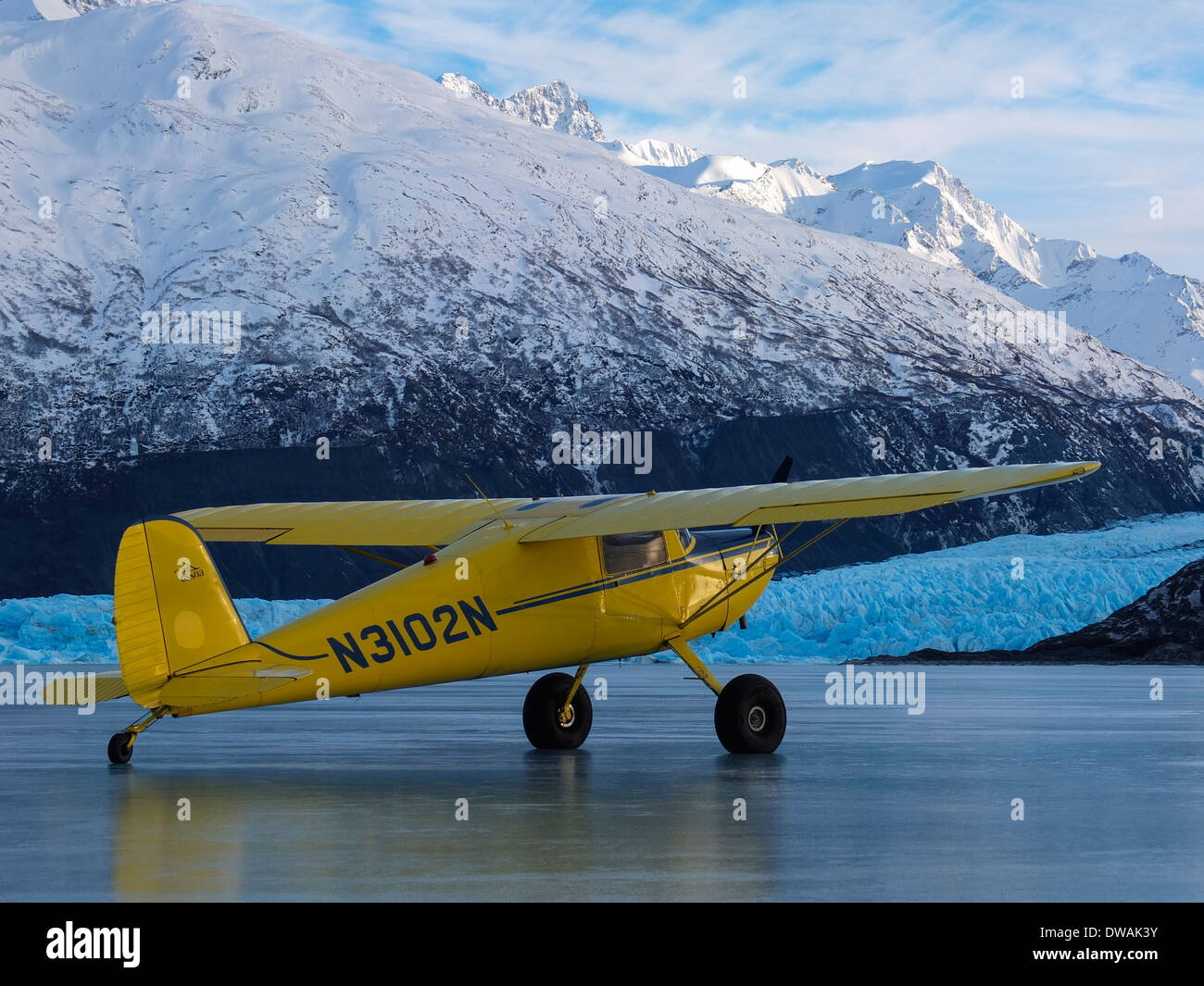 Photo off yellow Cessna 120 parked on the ice of frozen Inner Lake ...