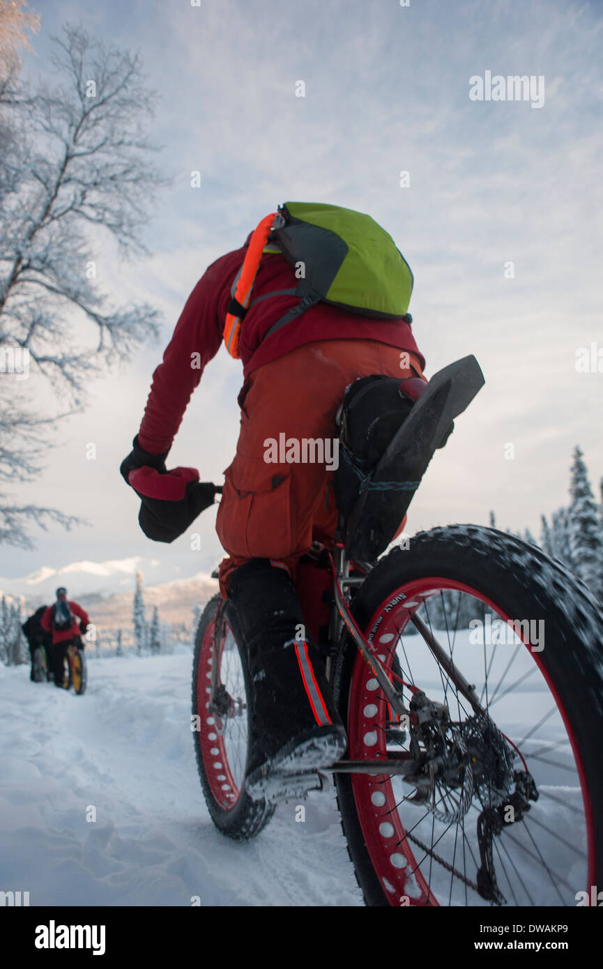 Low angle photo of person riding fat tire snow bike on the Speedway ...