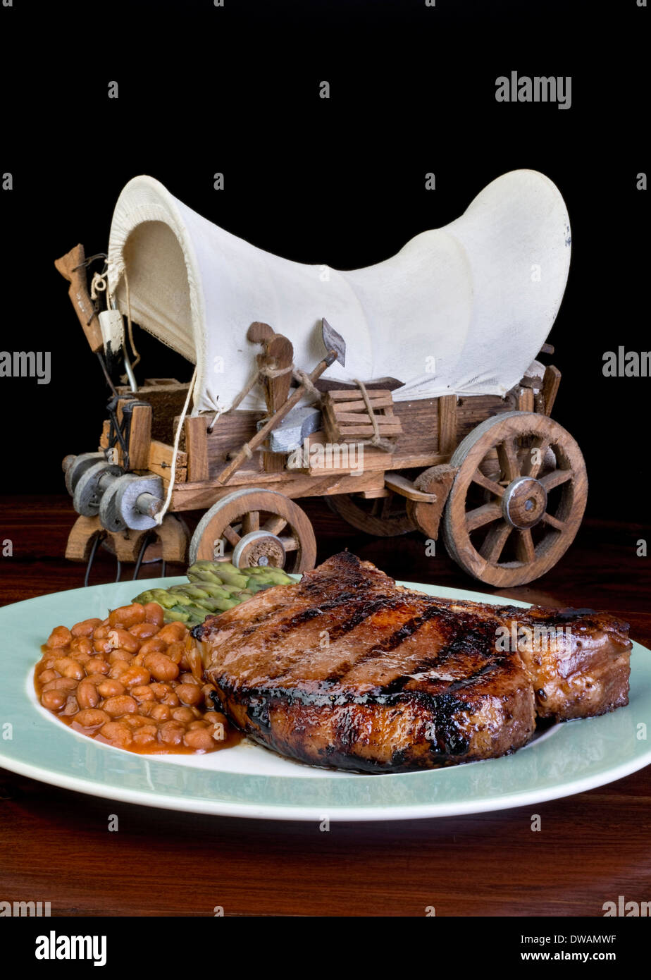 Thick two inch pork chops and cowboy wagon Stock Photo - Alamy