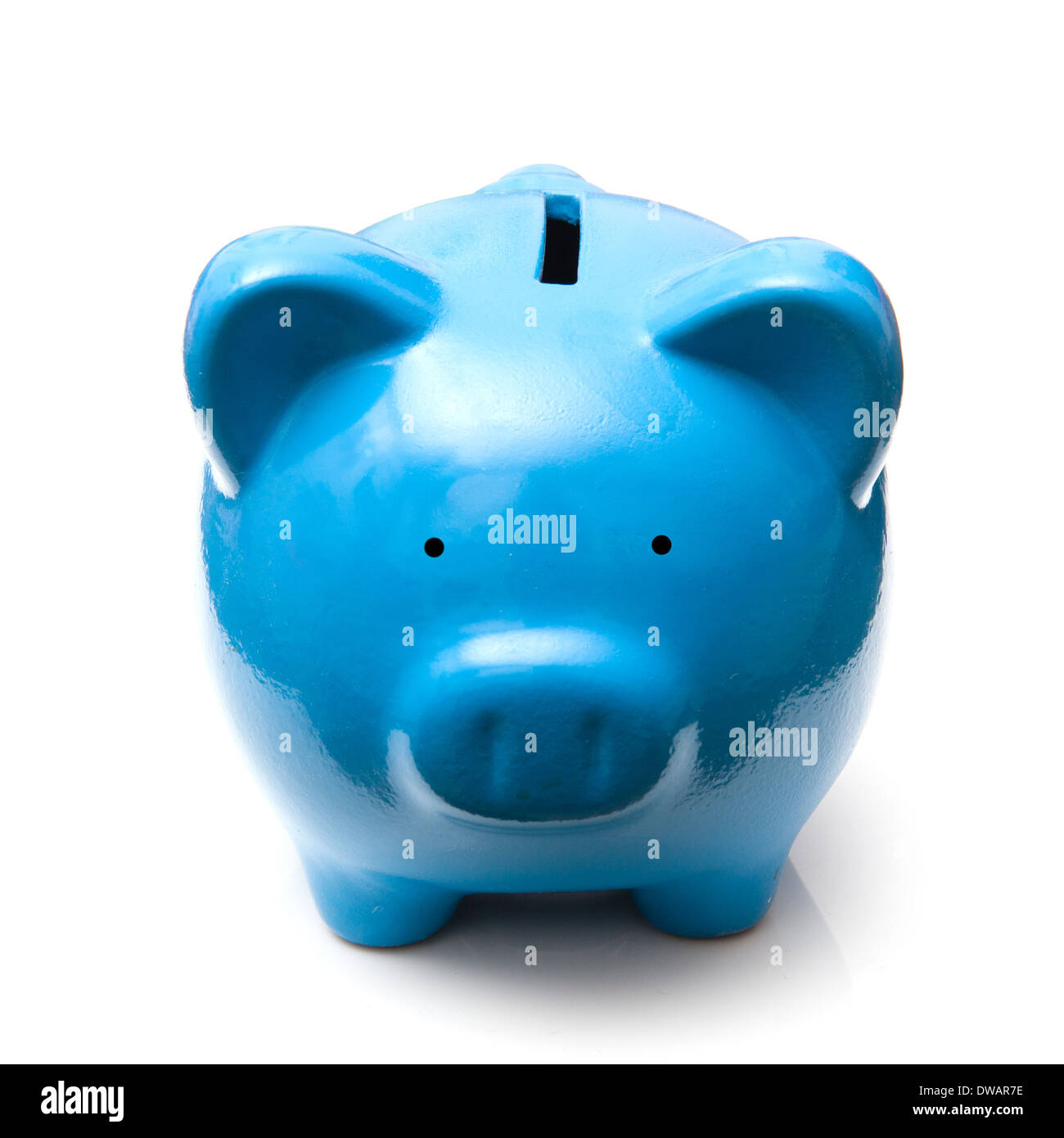 Blue piggy bank style money box isolated on a white studio background ...