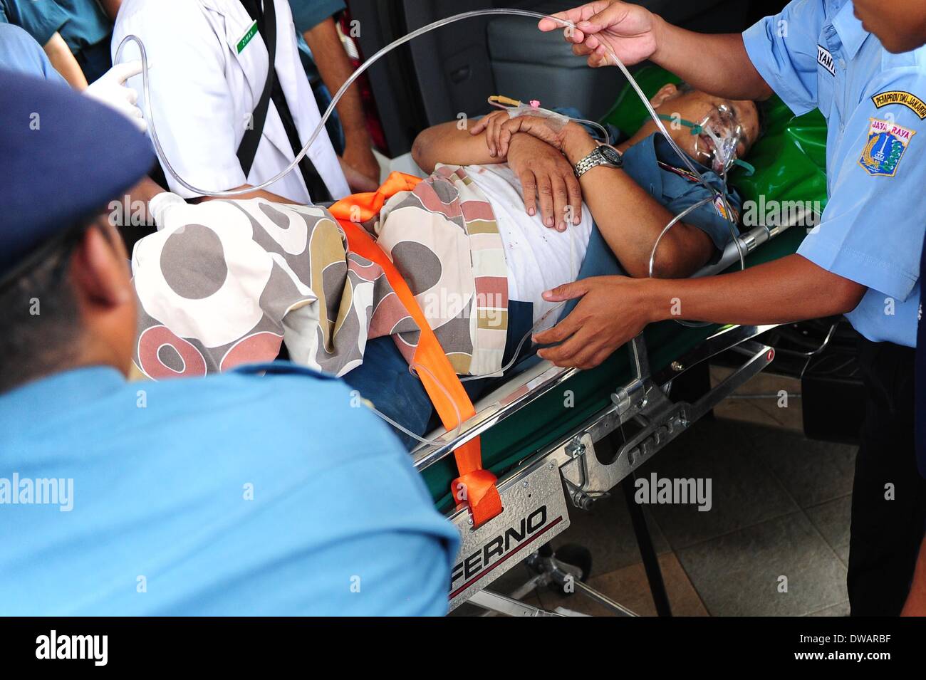 Jakarta, Indonesia. 5th Mar, 2014. A wounded is brought to the ...