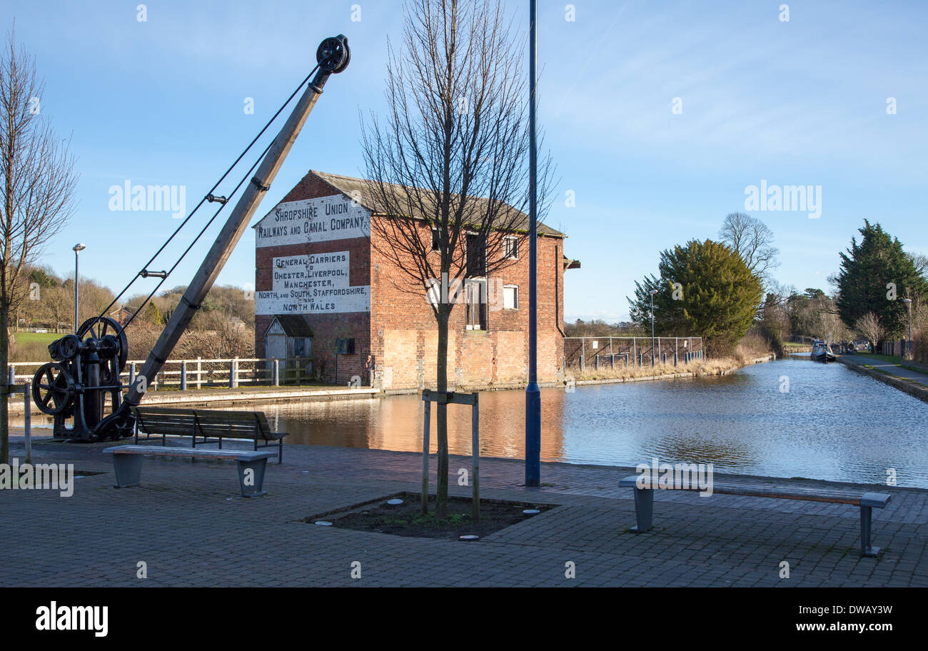 A crane and warehouse at the wharf on the Shropshire Union Canal at ...
