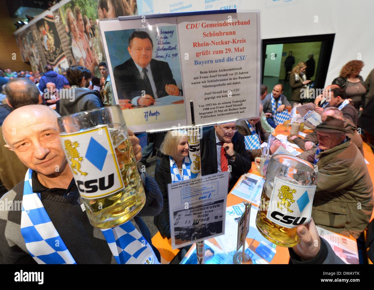 Passau, Germany. 05th Mar, 2014. CSU supporters toast to the camera ...