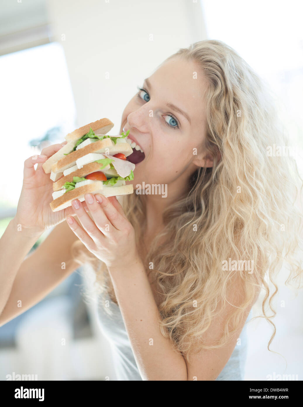 Person eating sandwich hi-res stock photography and images - Alamy