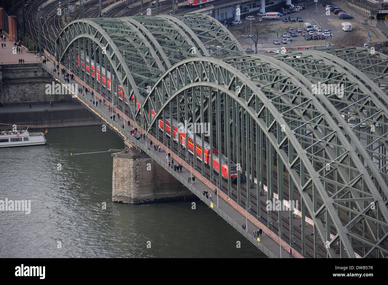 Cologne, Germany. 4th Mar, 2014. A train traverses the Hohenzollern ...