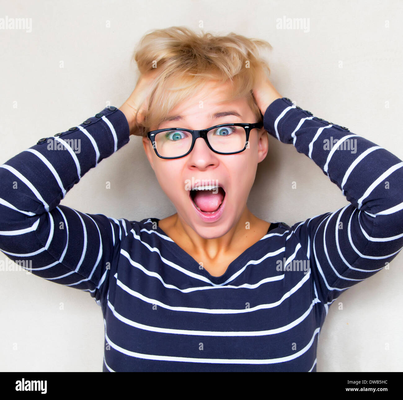 portrait of shocked woman with her hands on head Stock Photo - Alamy