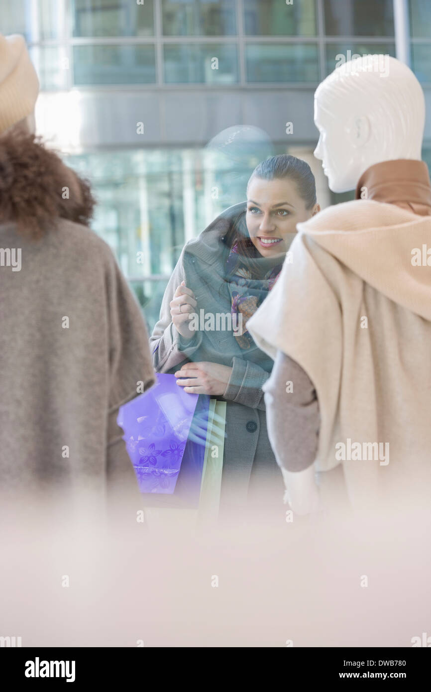Three young women shopping hi-res stock photography and images - Alamy