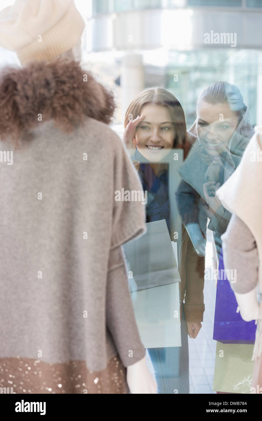 Female friends window shopping Stock Photo - Alamy