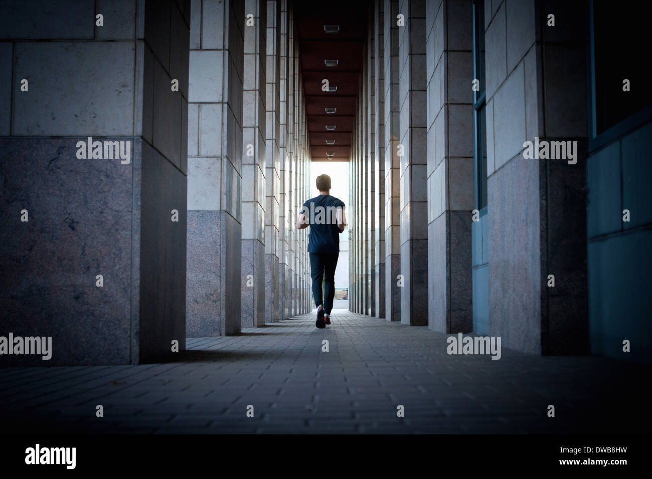 Young man running on urban hi-res stock photography and images - Alamy