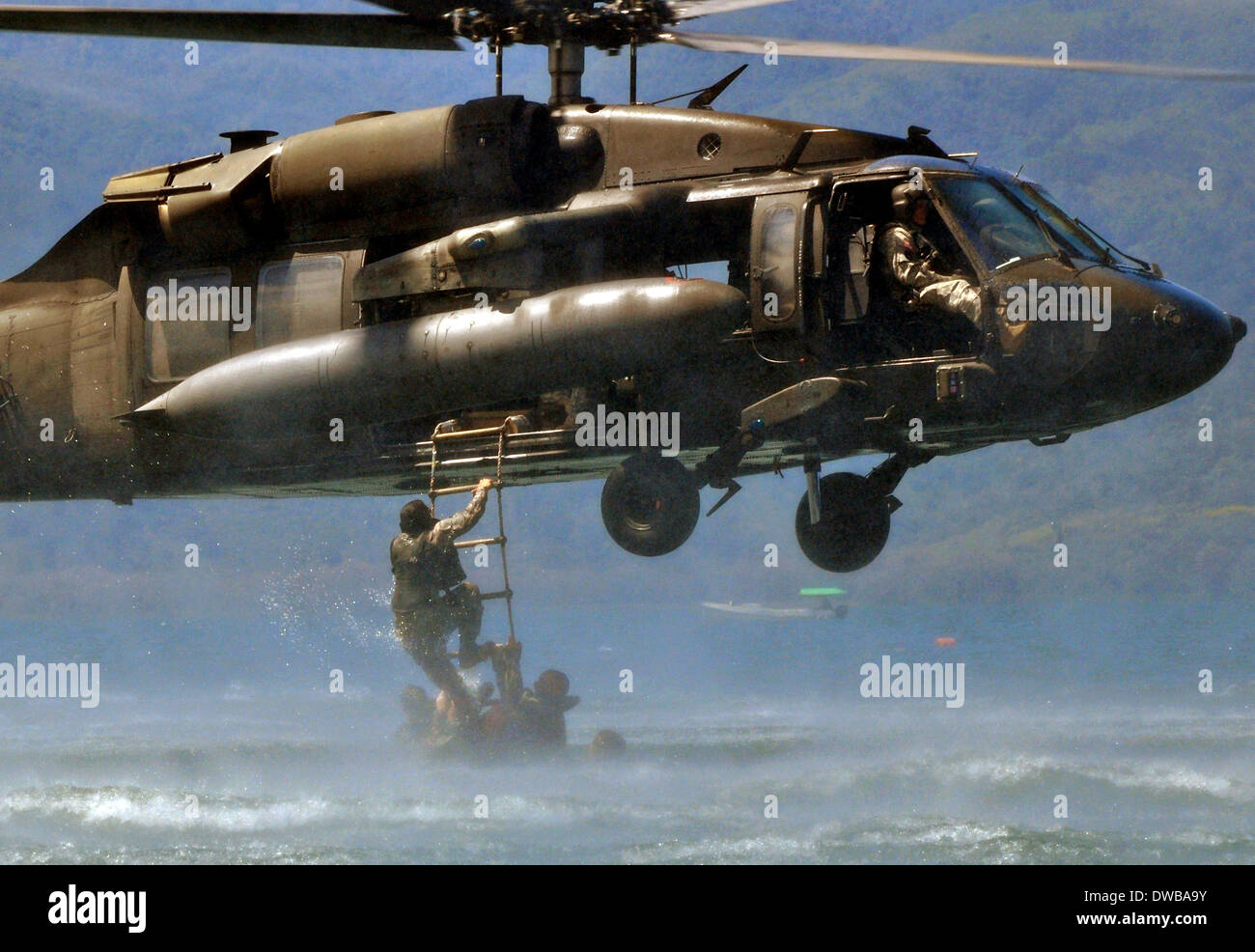 US special forces commandos with Joint Task Force Bravo climb a ladder ...