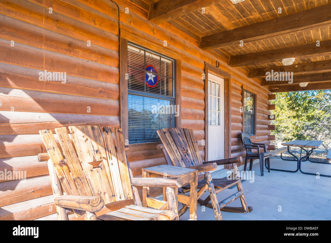 USA, Texas, Veranda of a log house with wooden chairs Stock Photo - Alamy