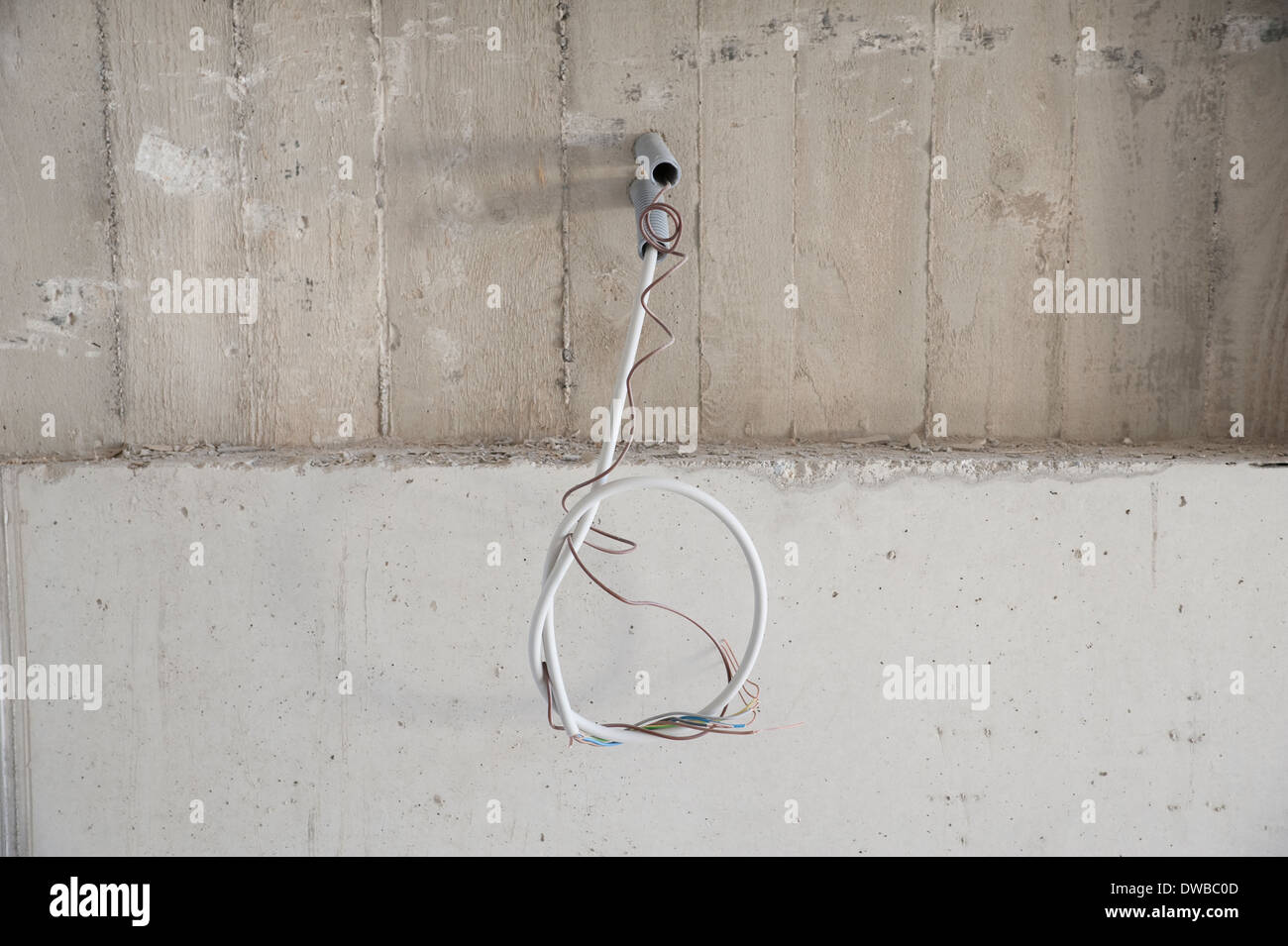 Cable at concrete wall on a construction site Stock Photo - Alamy