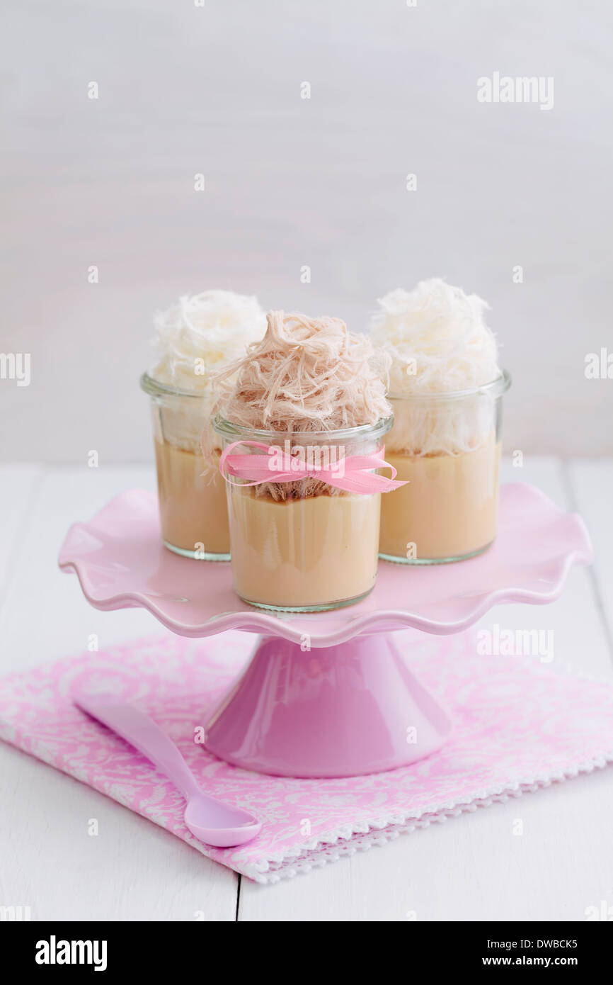 Caramel flan garnished with Turkish fairy floss Pashmak on cake stand ...