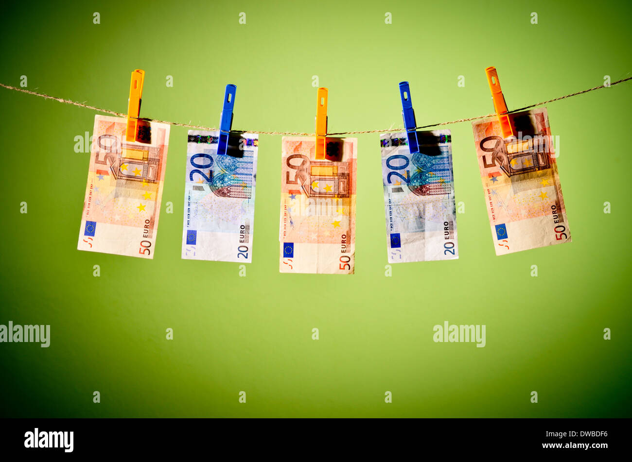 Euro bank notes hung on a clothes line with clothes pegs Stock Photo ...