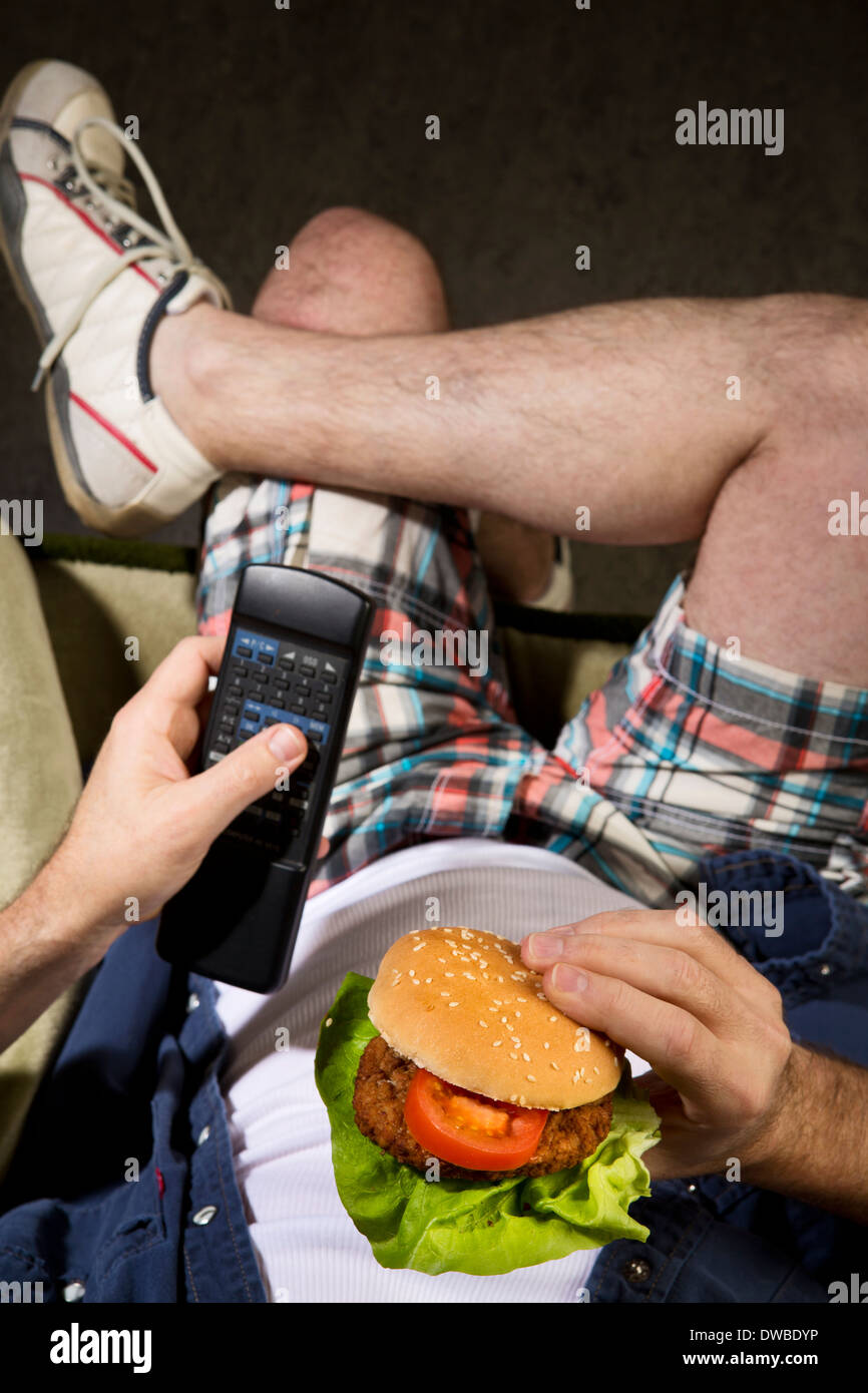 A man eats junk food Stock Photo - Alamy