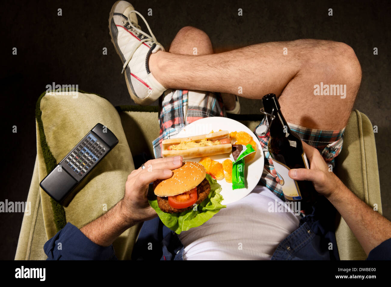A man eats junk food Stock Photo - Alamy