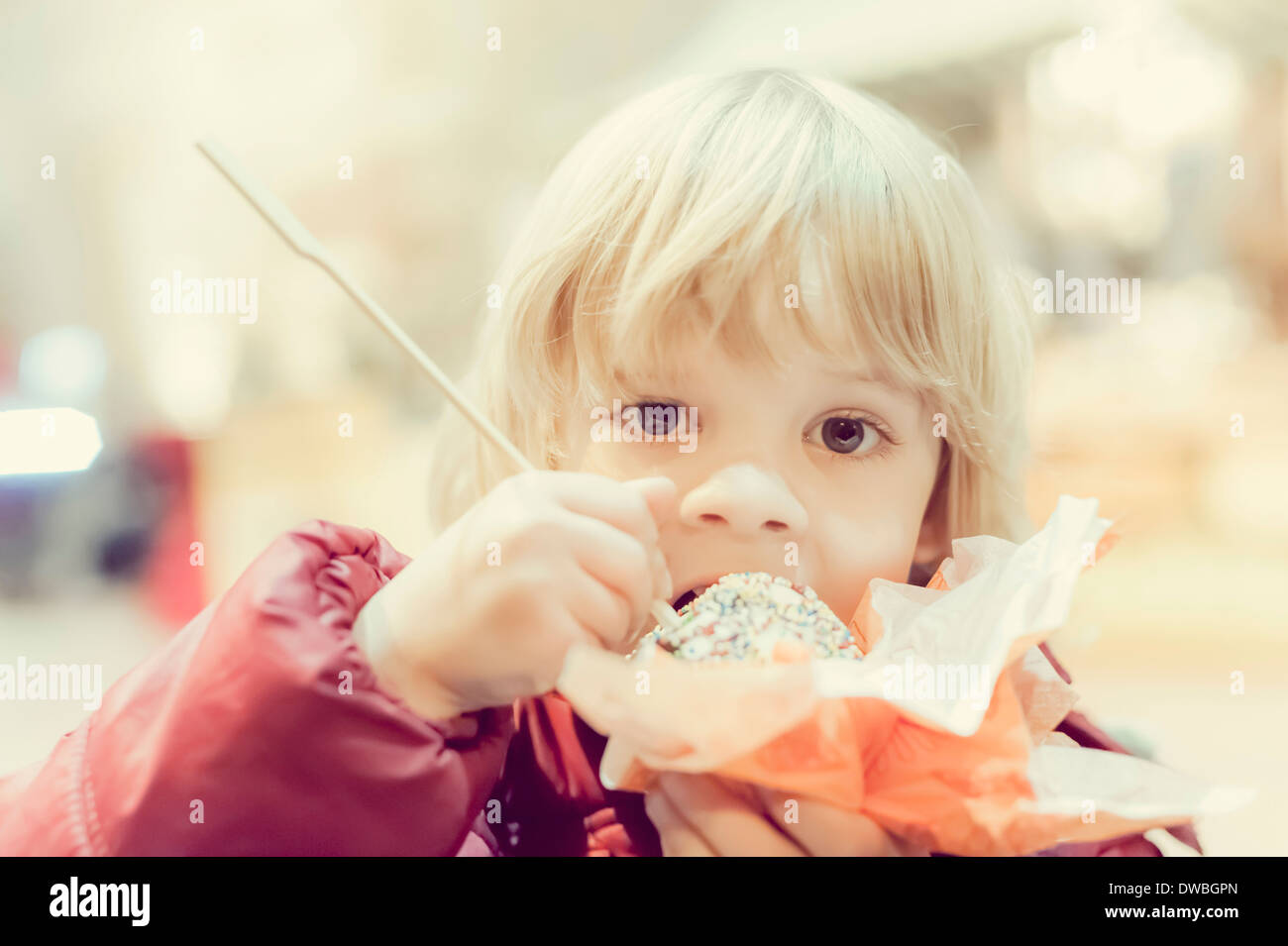 Boy eating candy apple Stock Photo - Alamy