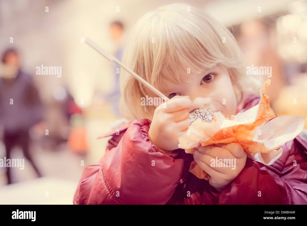 Boy eating candy apple Stock Photo - Alamy