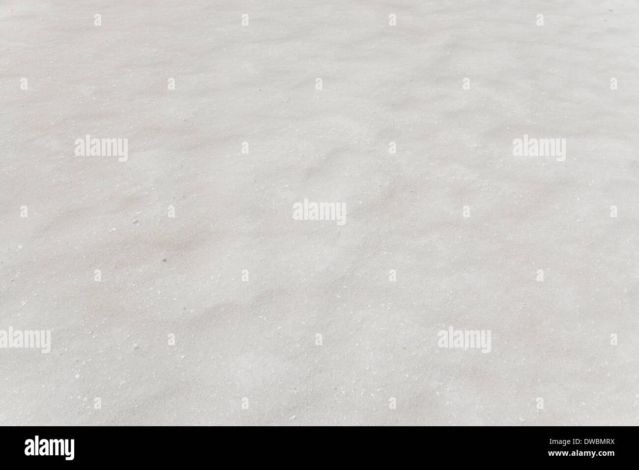 Wind blown sand creating subtle little micro-dunes on a beach. Texture ...