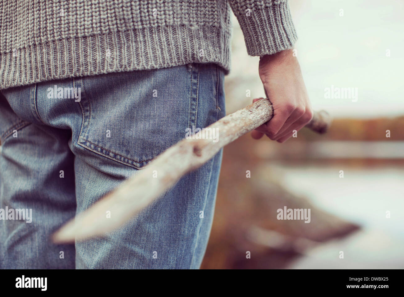 Man holding stick hi-res stock photography and images - Alamy