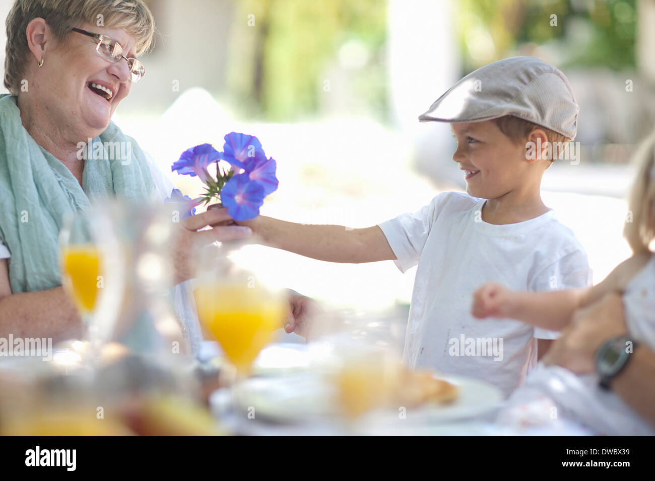 Girl giving boy flowers hi-res stock photography and images - Alamy