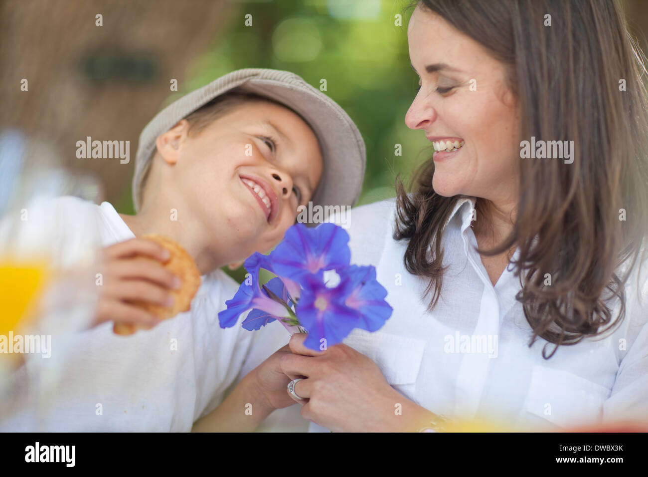 Child giving flowers to adult hi-res stock photography and images - Alamy
