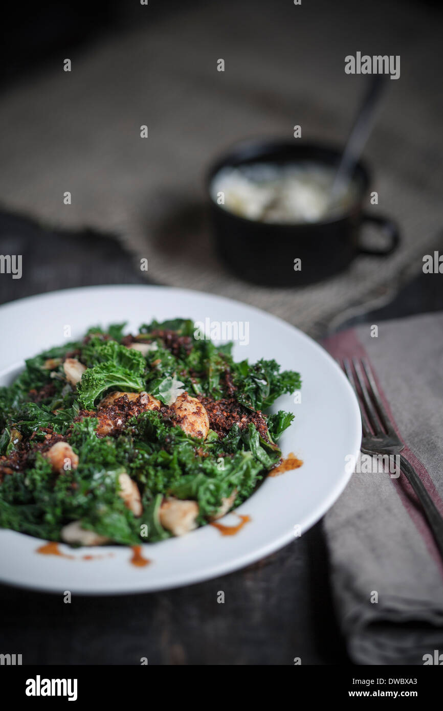 Stir fried kale with white beans and Pul Biber (turkish paprika spice ...