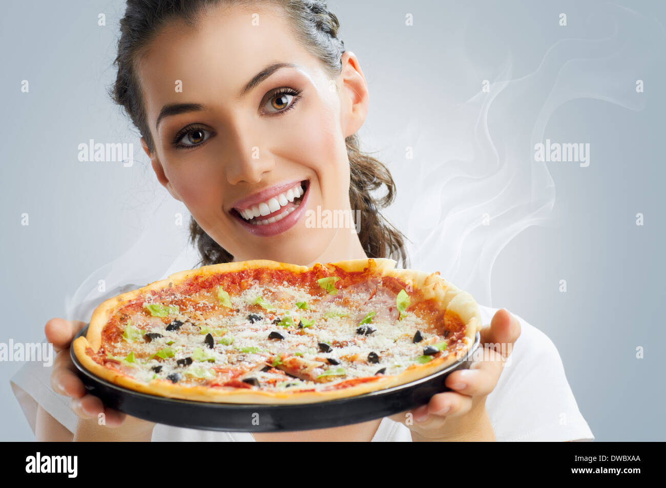 Girl eating a delicious pizza Stock Photo - Alamy