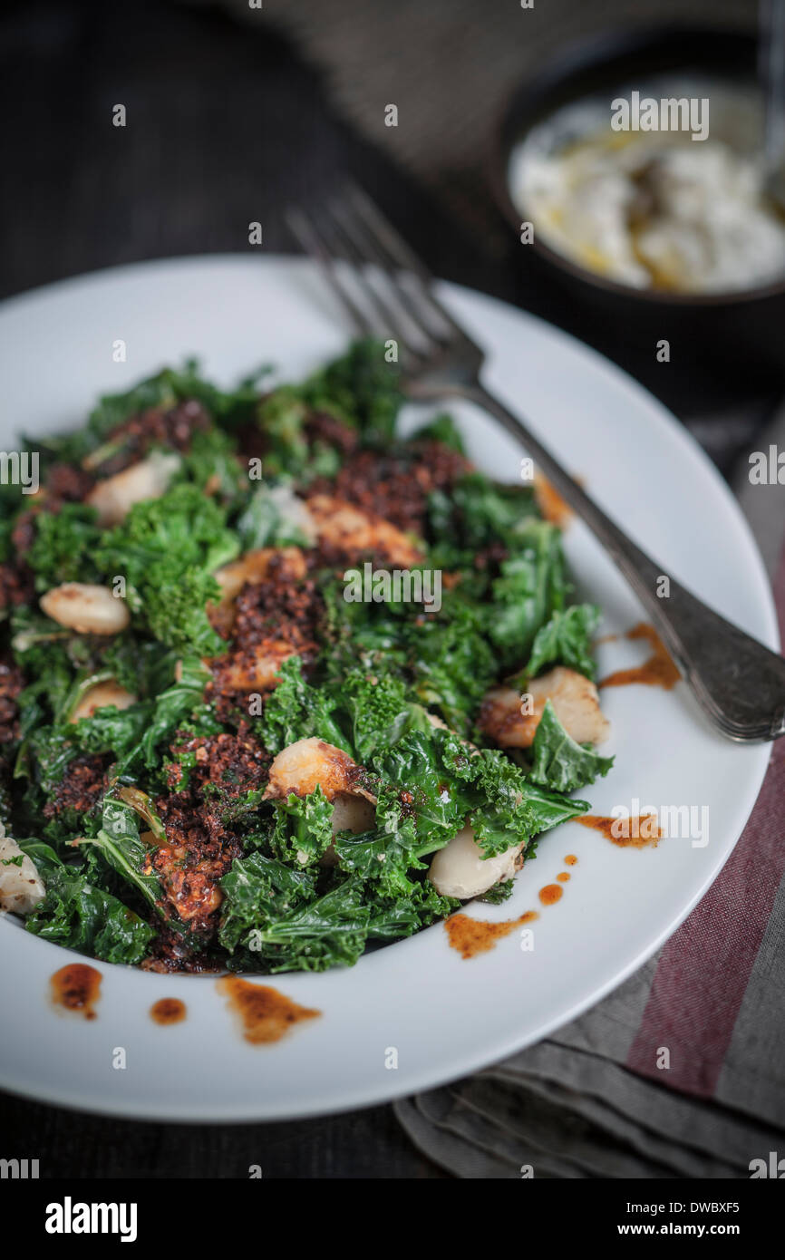 Stir fried kale with white beans and Pul Biber (turkish paprika spice ...