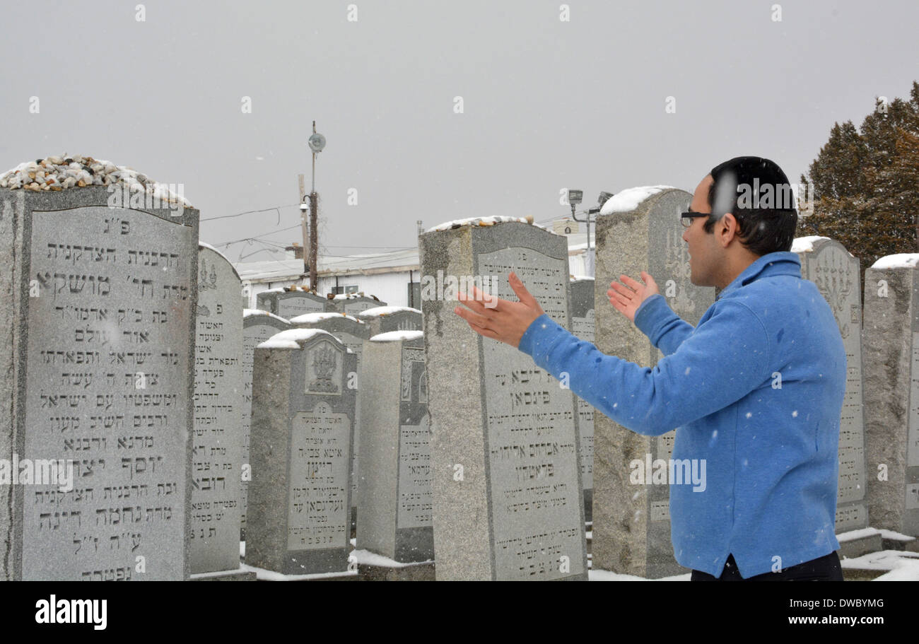 Religious Jewish man in fervent prayer at the Ohel, the burial place of ...