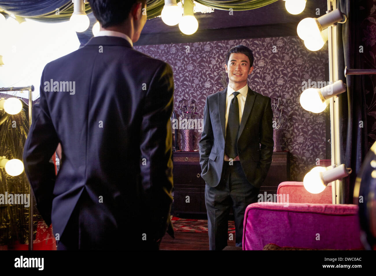 Young male client trying on new suit in traditional tailors shop Stock ...