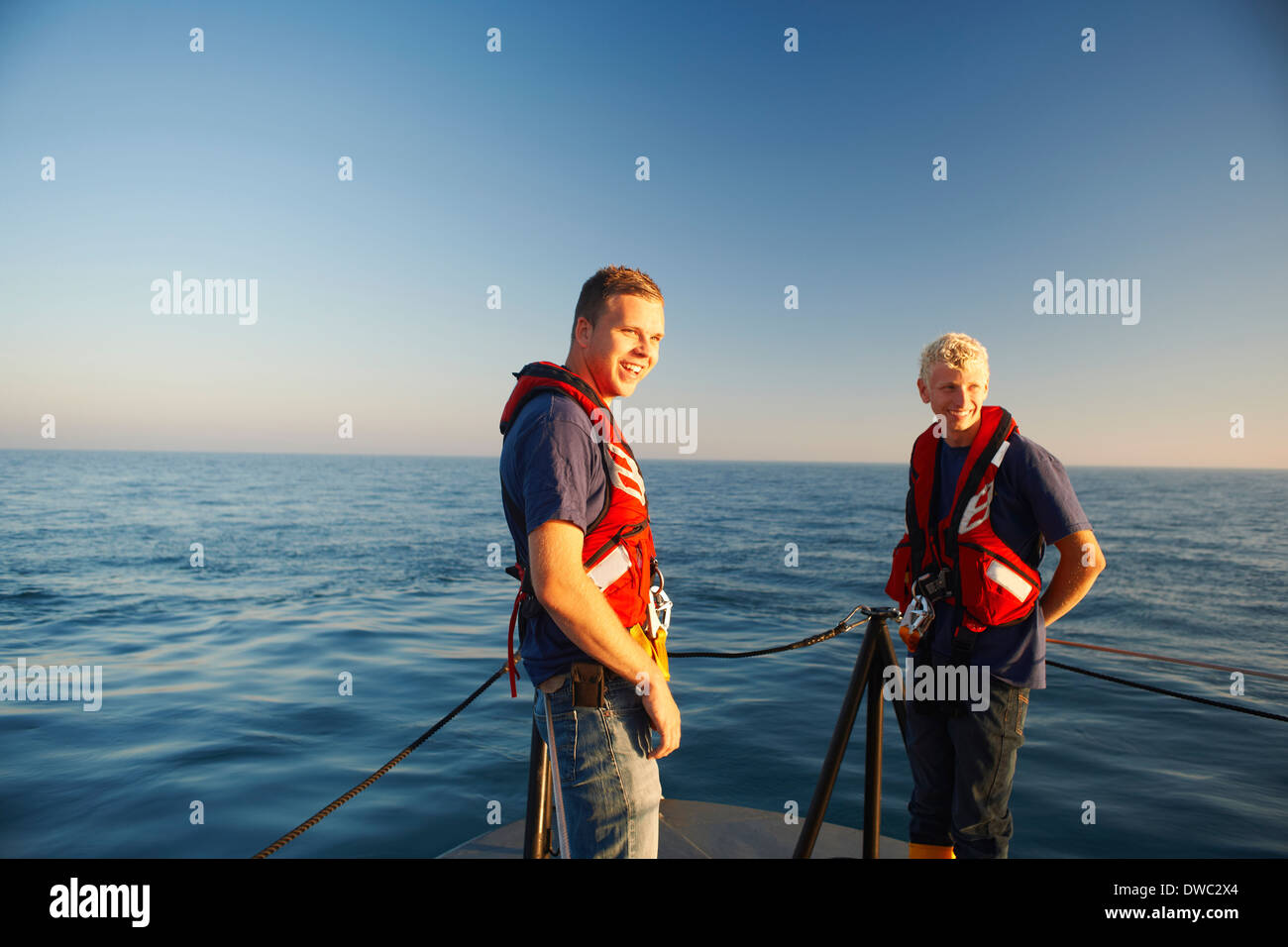 Portrait of two male lifeboat crew at sea Stock Photo - Alamy