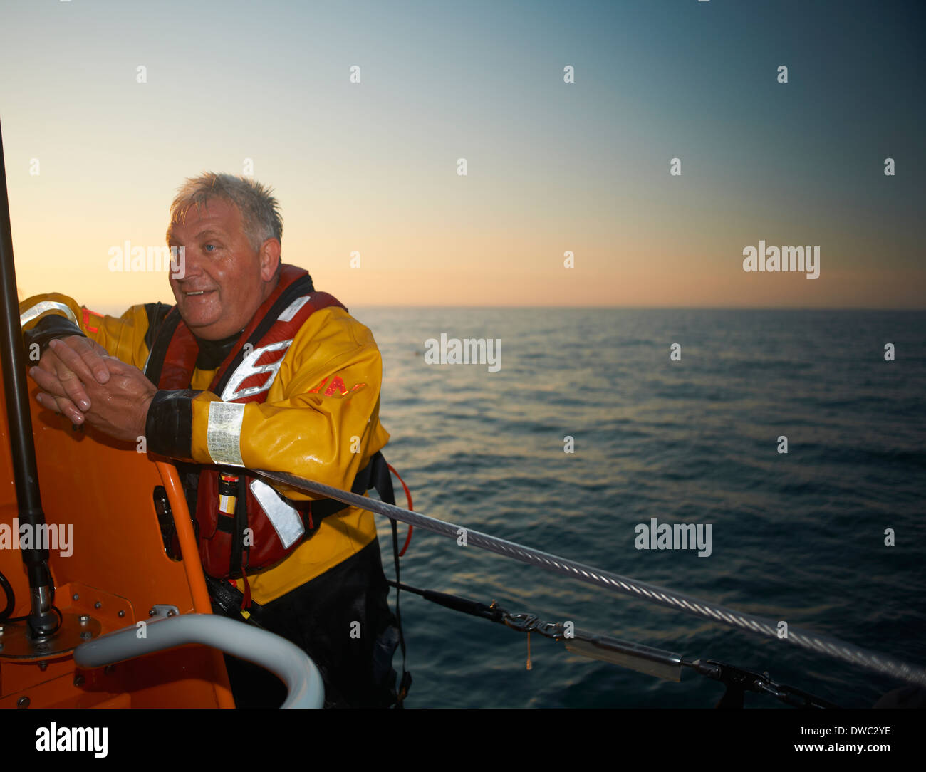Portrait of mature man crewing lifeboat at sea Stock Photo - Alamy