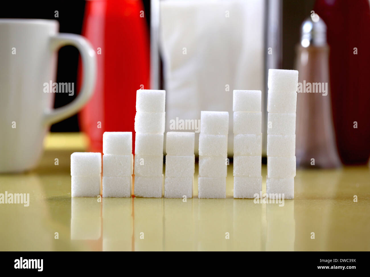 Sugar lumps stacked in shape of graph Stock Photo - Alamy