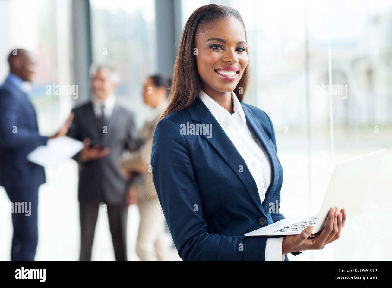 smiling African businesswoman with laptop computer Stock Photo - Alamy