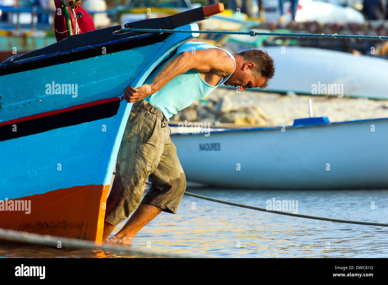 North Africa, Tunisia, Cape Bon, Hammamet. Fisherman returning his boat ...
