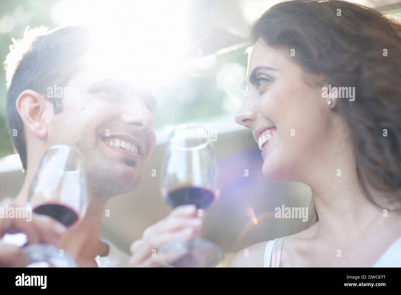 Young couple enjoying wine tasting at vineyard Stock Photo - Alamy