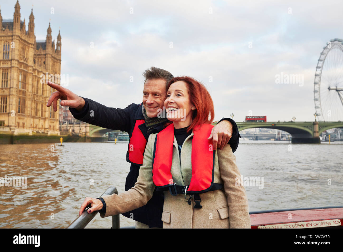 Mature tourist couple sightseeing on Thames boat, London, UK Stock ...