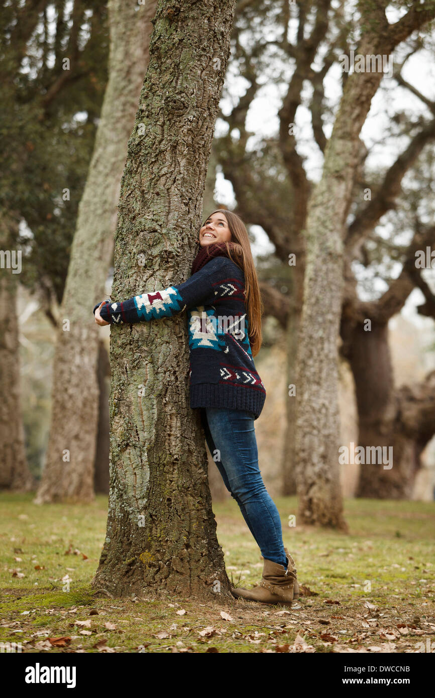 Woman hugging tree in forest hi-res stock photography and images - Alamy