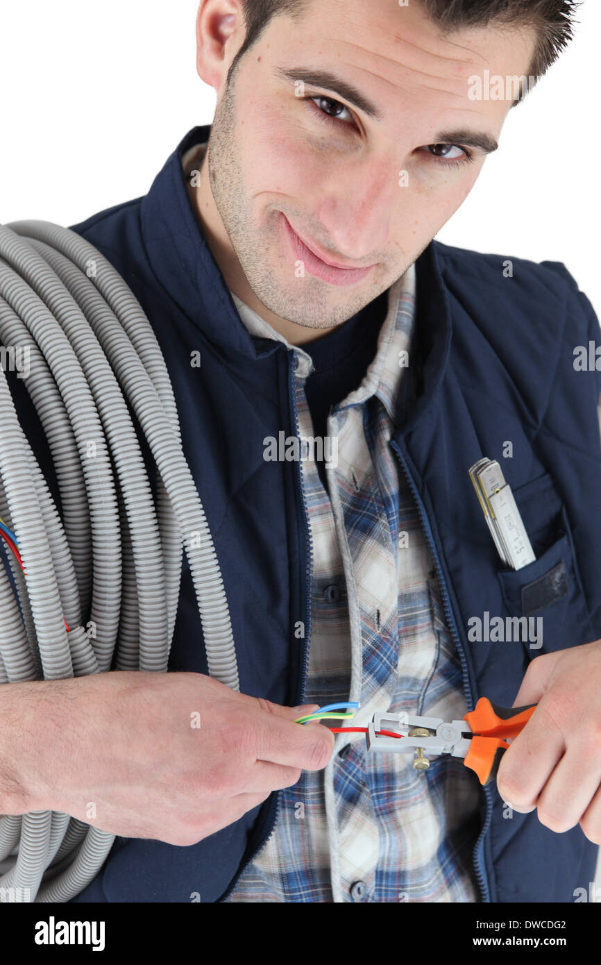 Man pulling electrical wires Stock Photo - Alamy