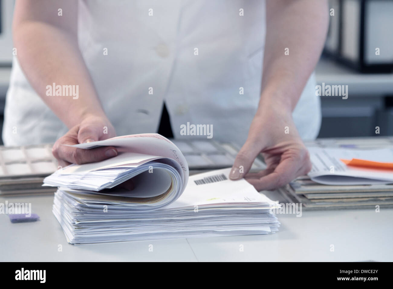 Women checking paperwork hi-res stock photography and images - Alamy