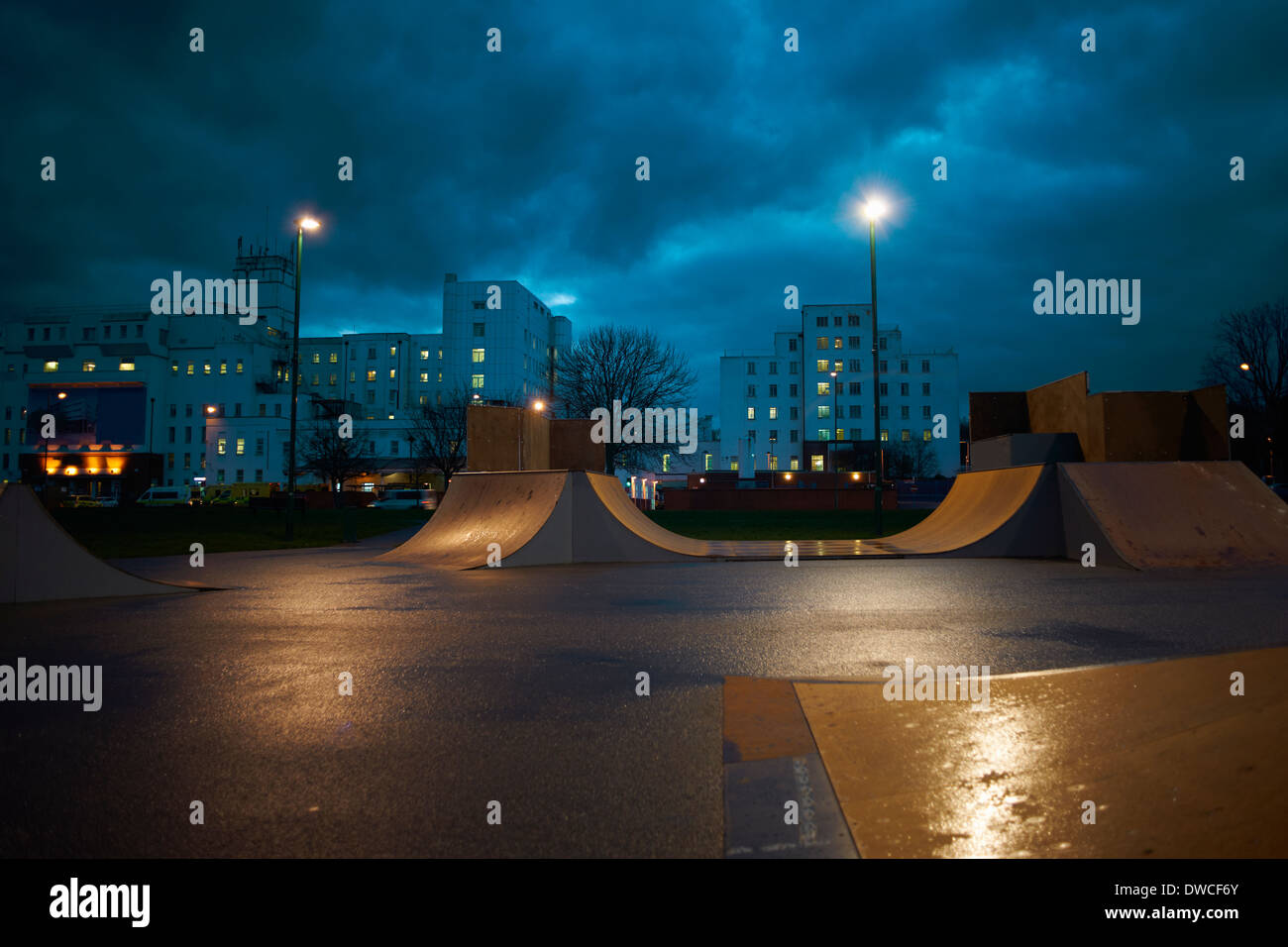Cityscape and skateboard park at night Stock Photo - Alamy