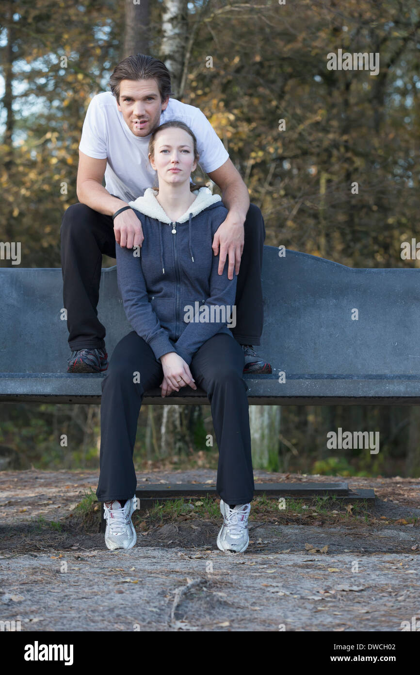 Couple sitting on bench hi-res stock photography and images - Alamy