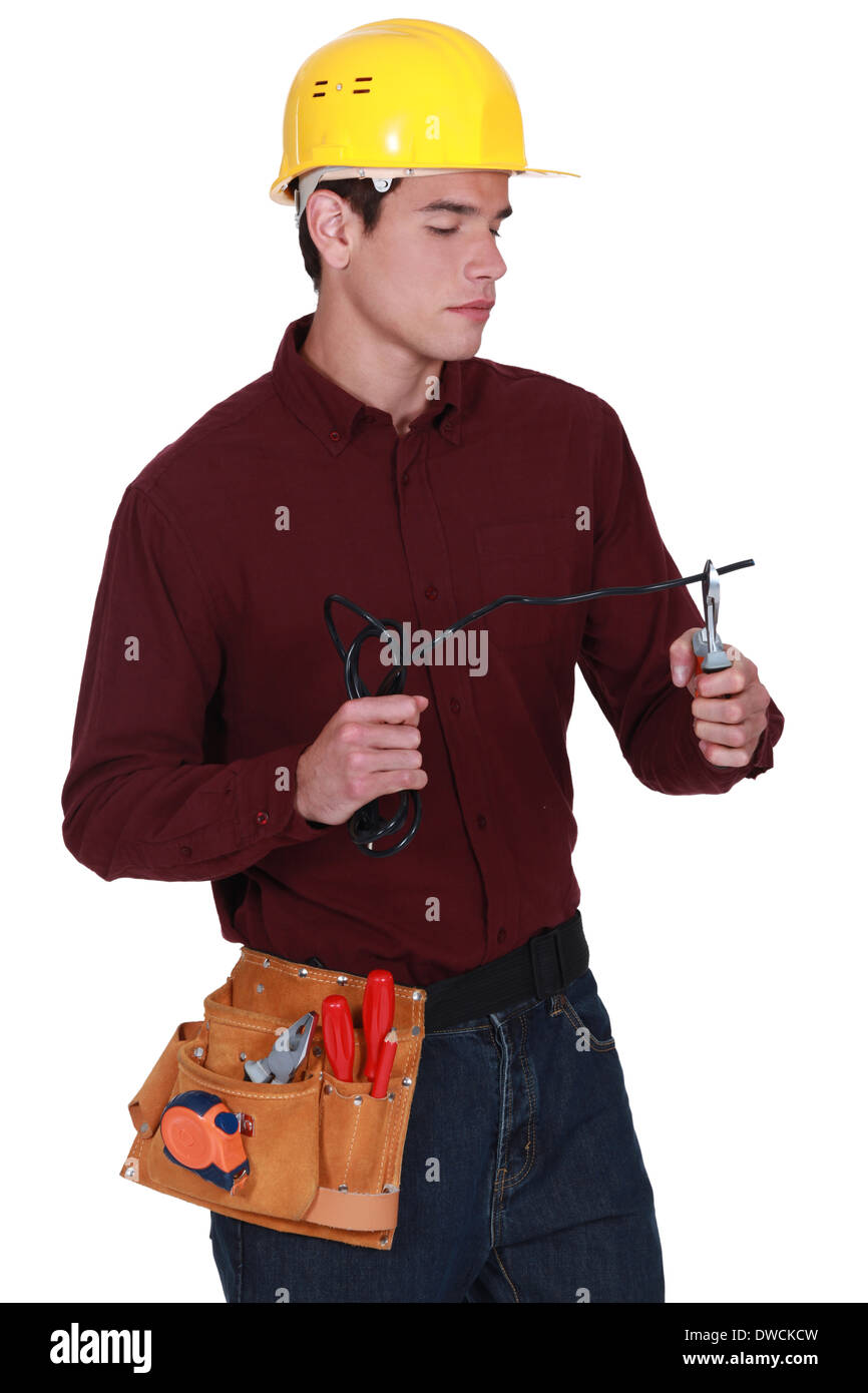 Electrician snipping electrical cable Stock Photo - Alamy