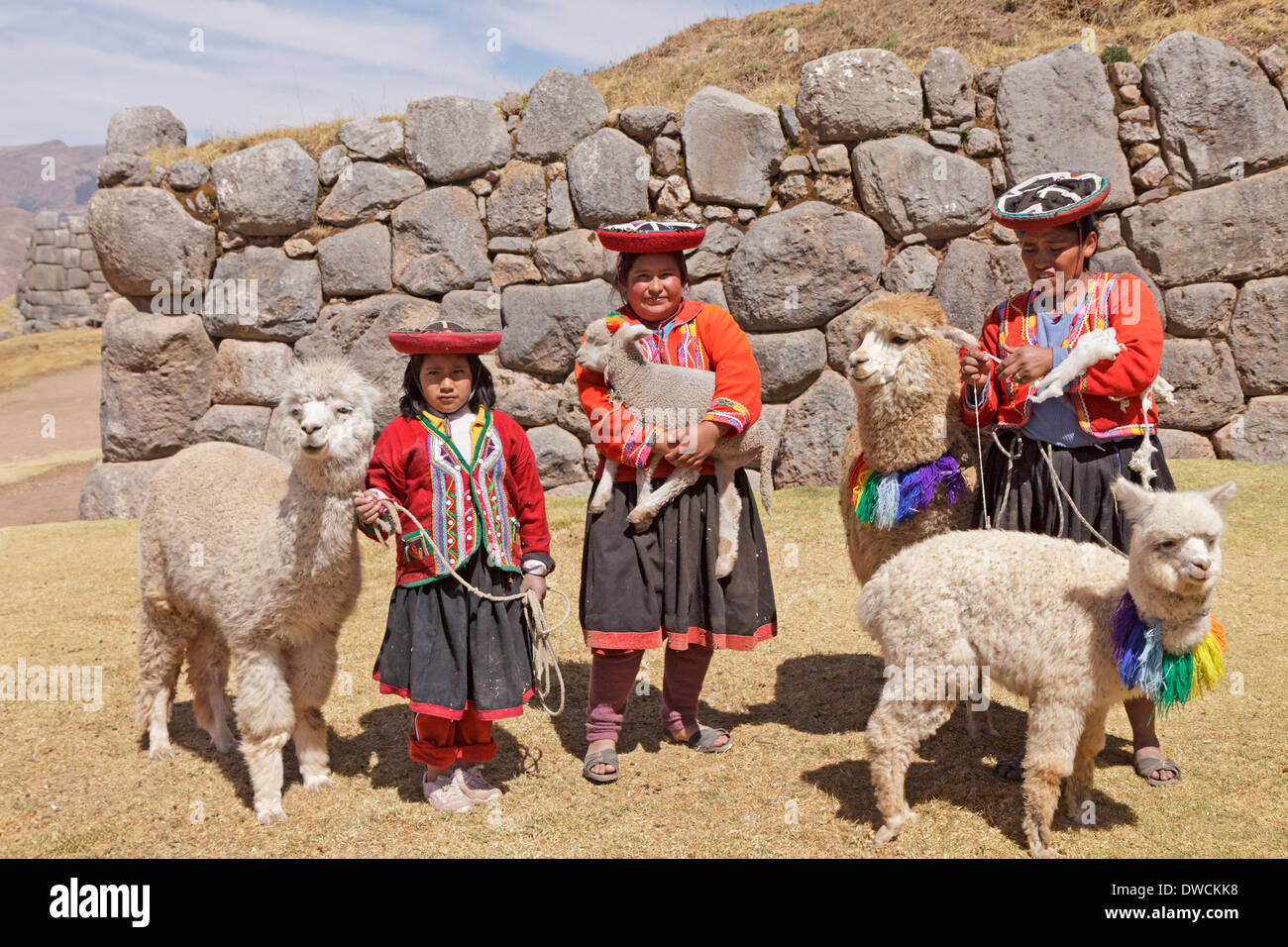 native women and girl with alpacas, Inca Fortress Sacsayhuaman, Cuzco ...