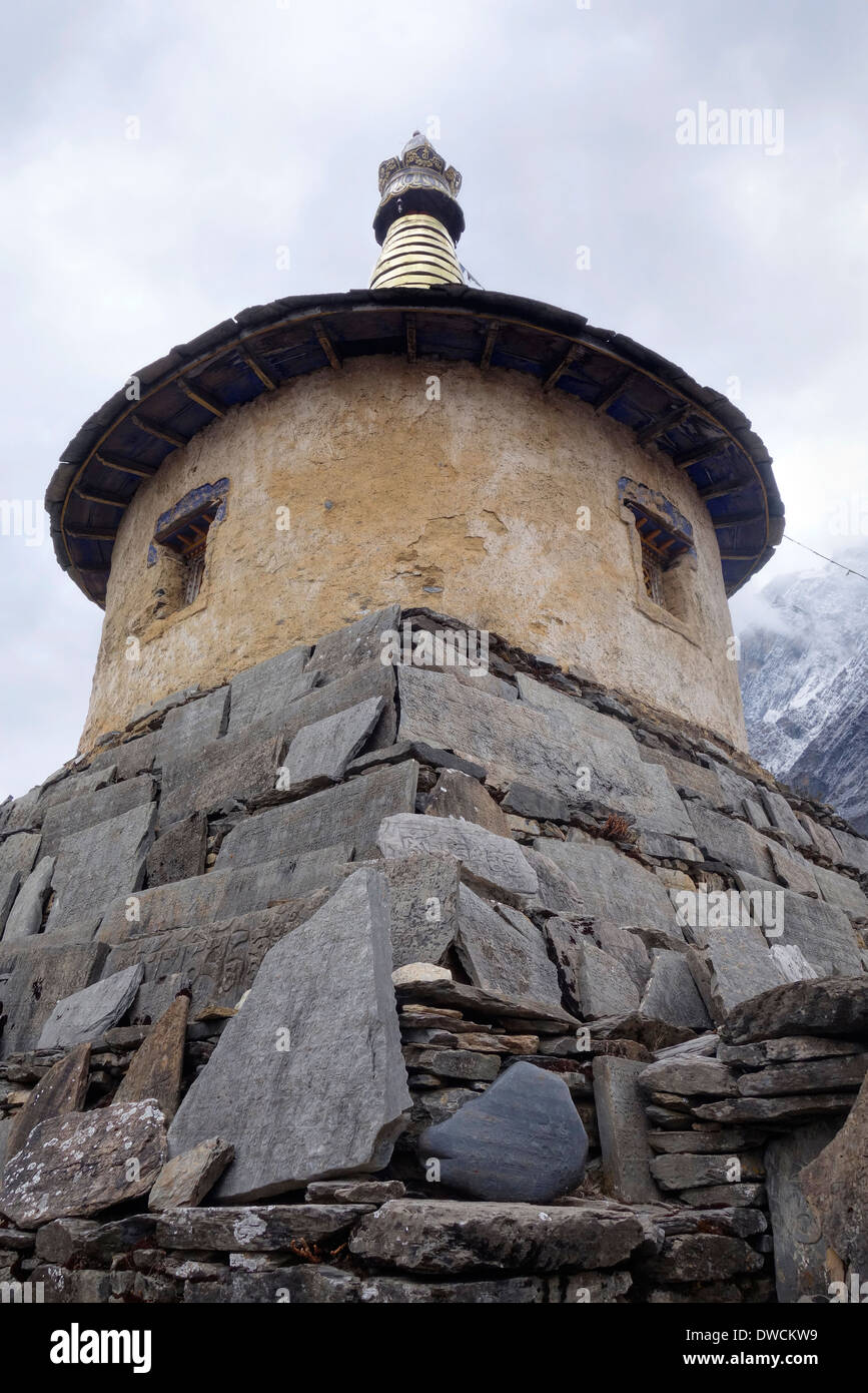 Stupa, also known as Chorten, and mani stones in the Tsum Valley, Nepal ...