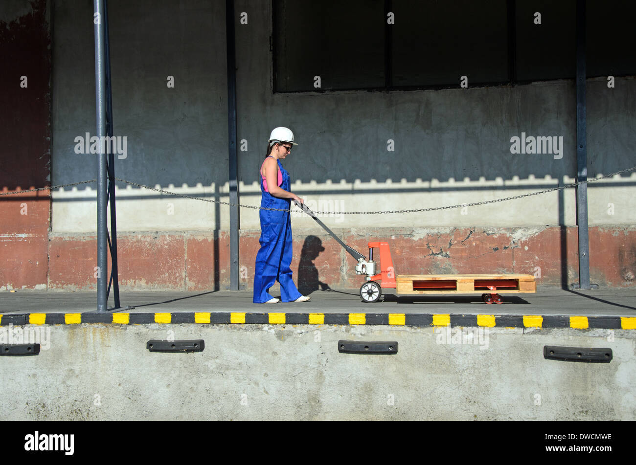 image of a working woman at the loading trolley Stock Photo - Alamy