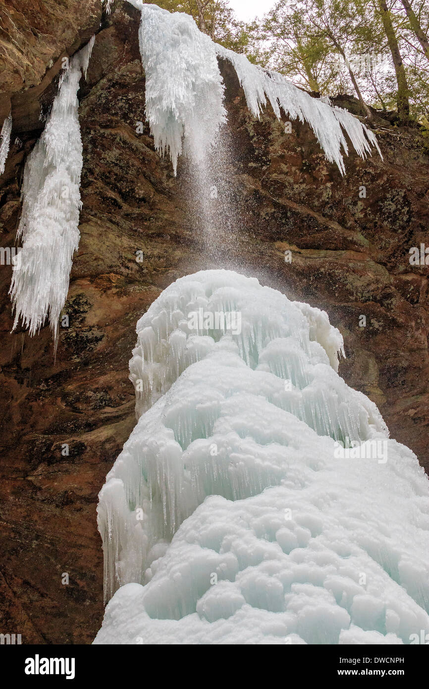 Giant ice cone that has formed at the base of the waterfall at Ash Cave ...