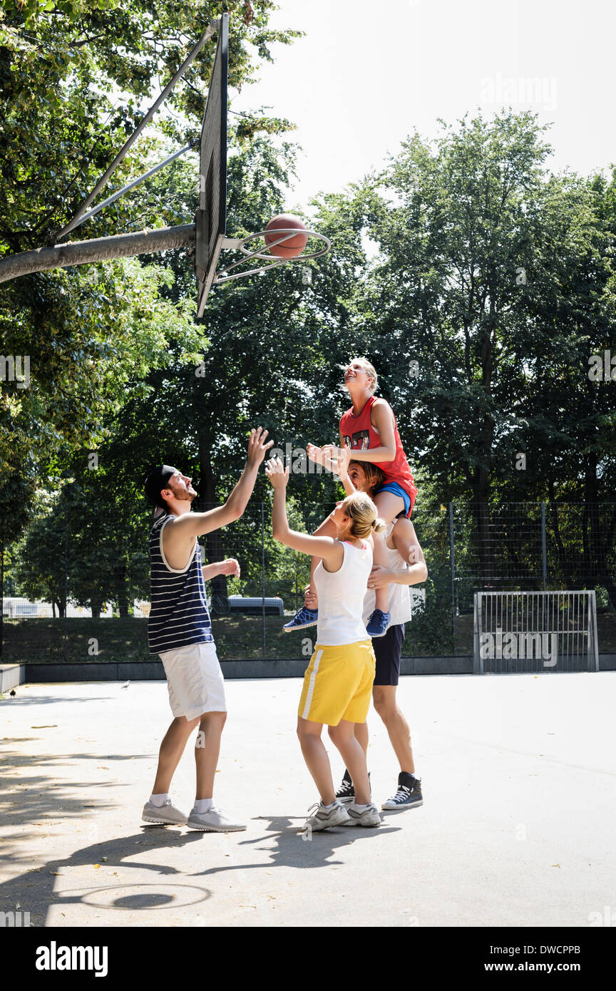 Woman carrying basketball hi-res stock photography and images - Alamy